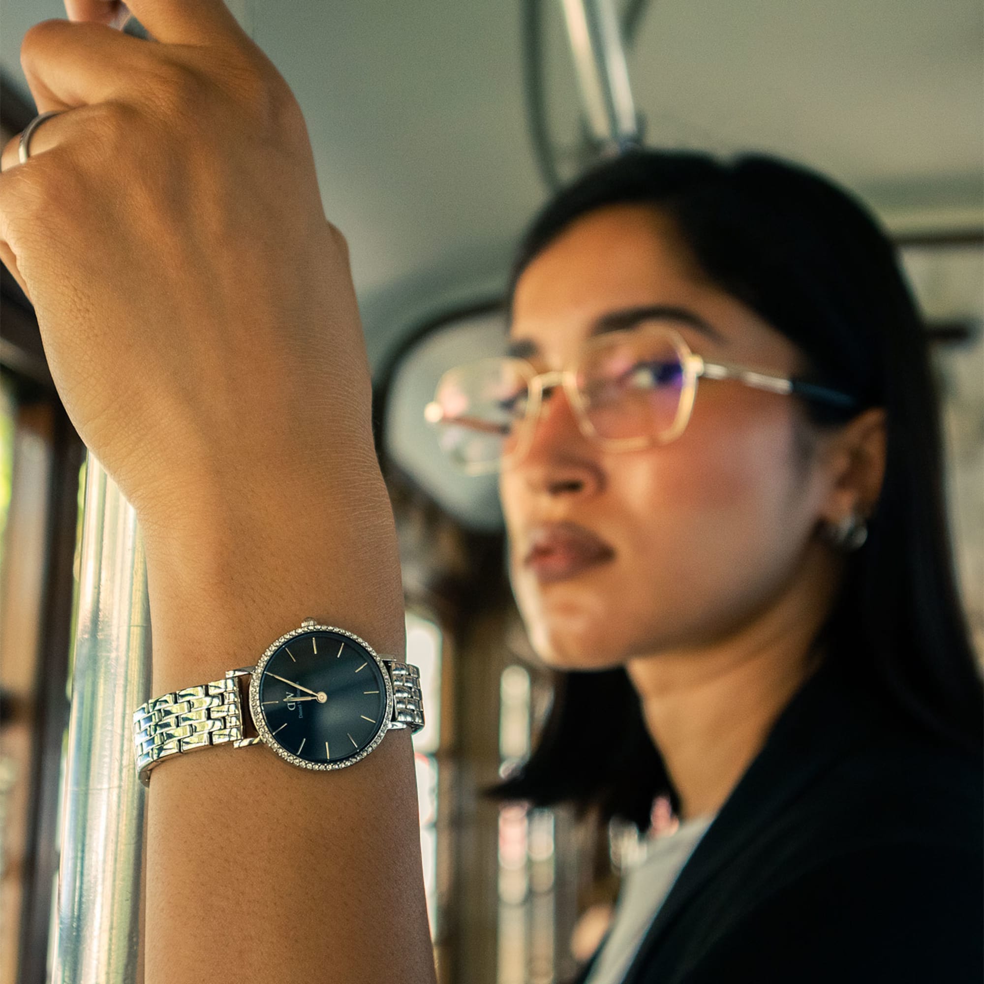 A small watch with an arctic sunray watch with silver 5-link strap. The ...